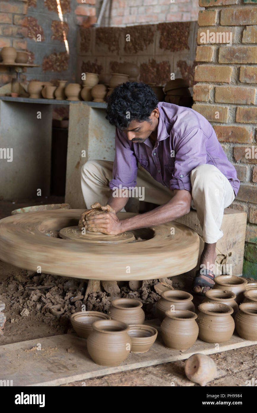 Mumbai, India - July 8, 2018 - Indian craftman doing pottery in a ...