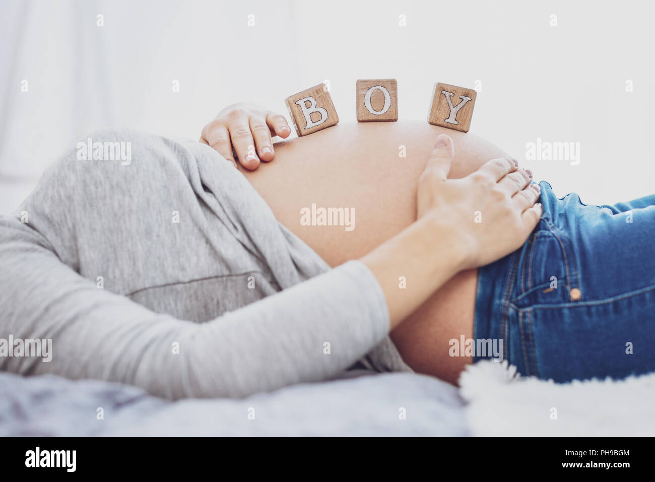 Young pregnant woman expecting a boy Stock Photo - Alamy