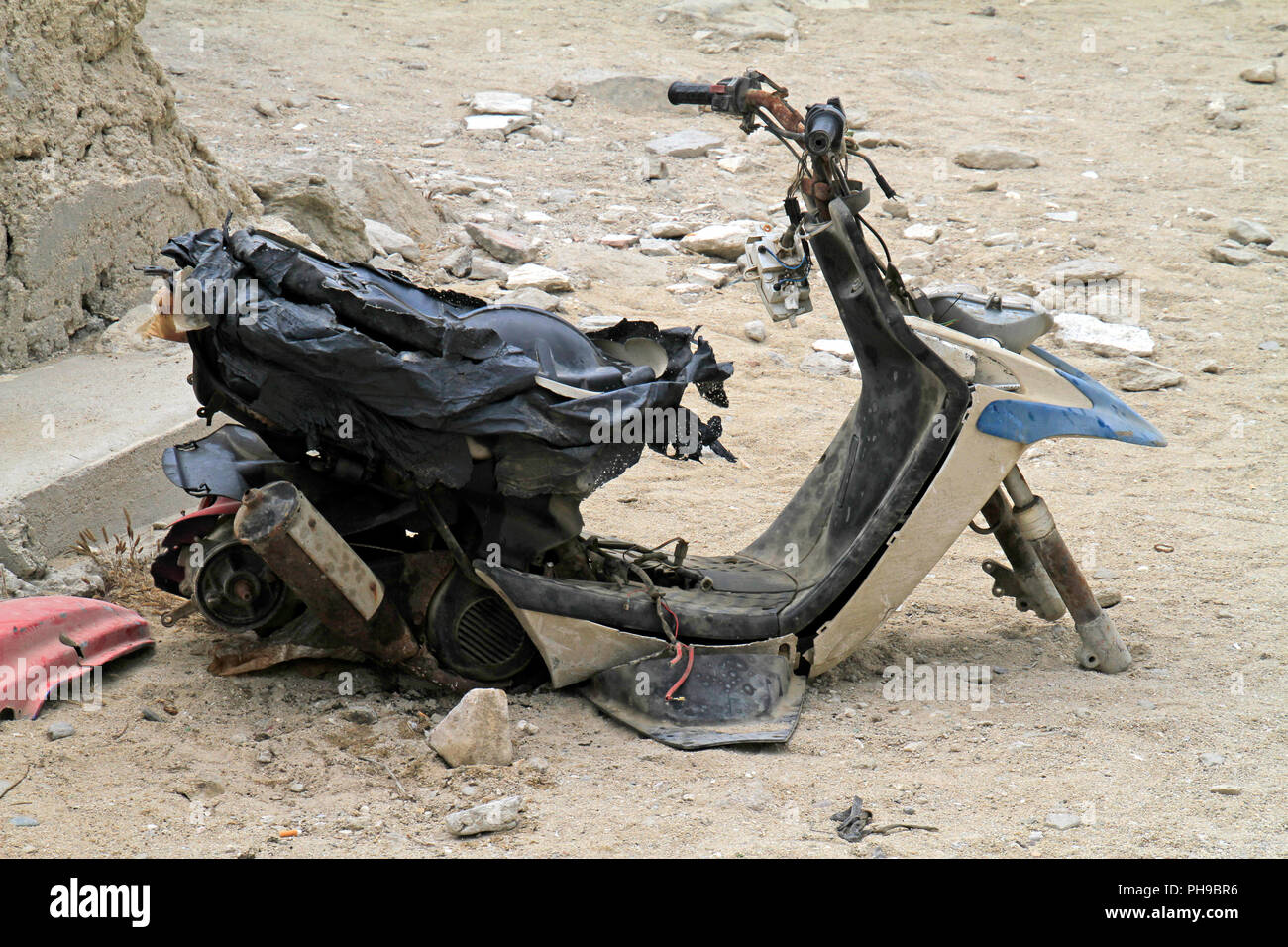 Heavily damaged scooter abandoned on a parking lot Stock Photo - Alamy
