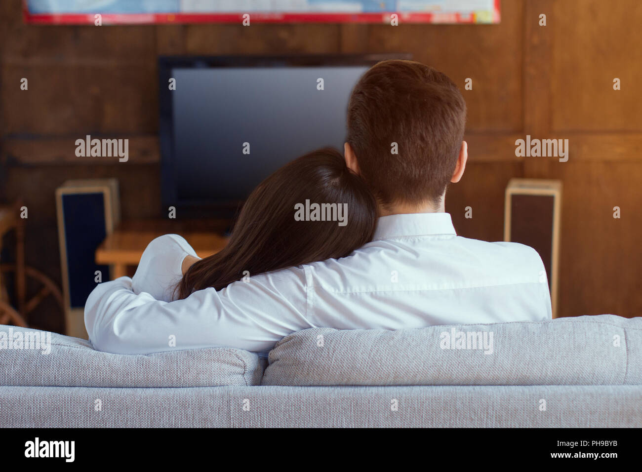 Delighted couple on couch having a rest. Woman resting her head on mans ...