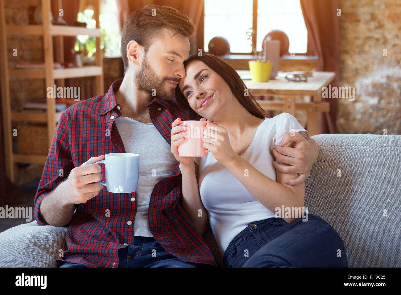 happy young couple relax at modern home living room indoor. Couple in ...