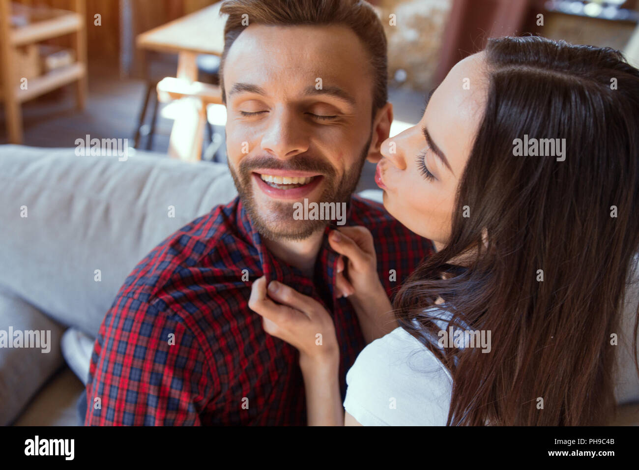 happy young couple relax at modern home living room indoor. Couple in ...