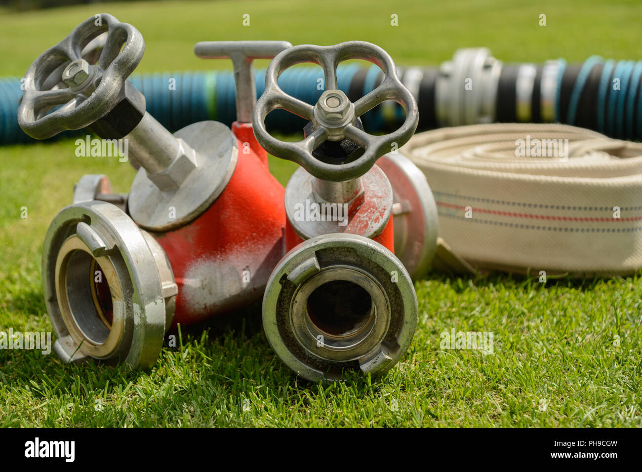 Rolled up fire hose hi-res stock photography and images - Alamy