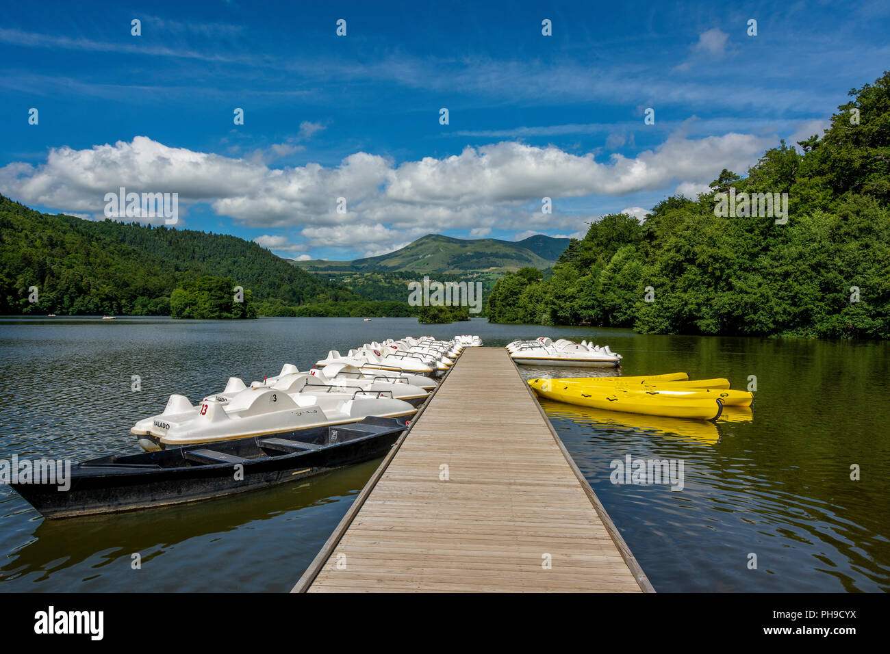 Boats docked at the Lac Chambon pontoon, Puy de Dome department ...
