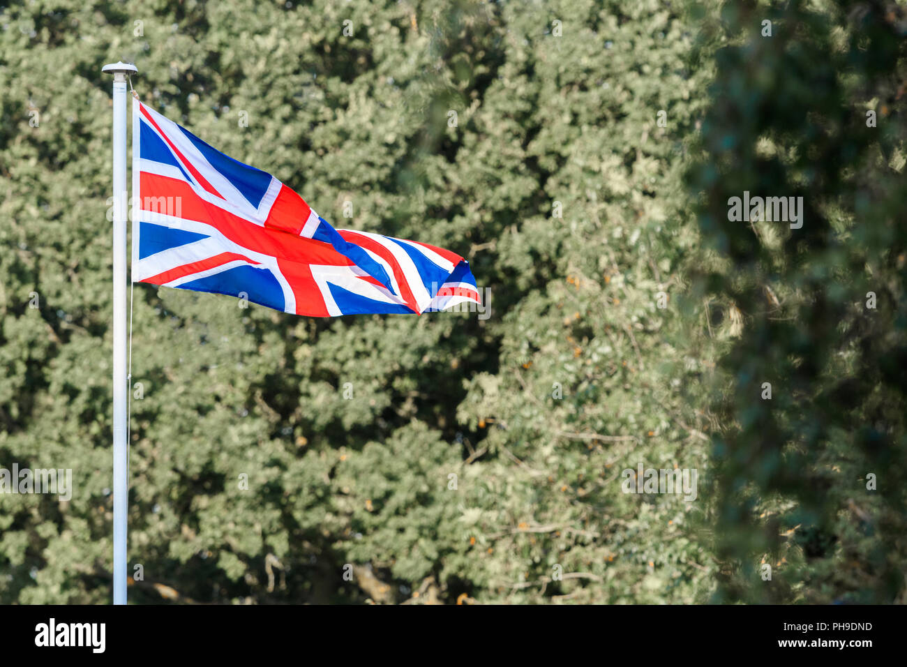 British union jack flag flutters in the wind outside a house in Corby ...