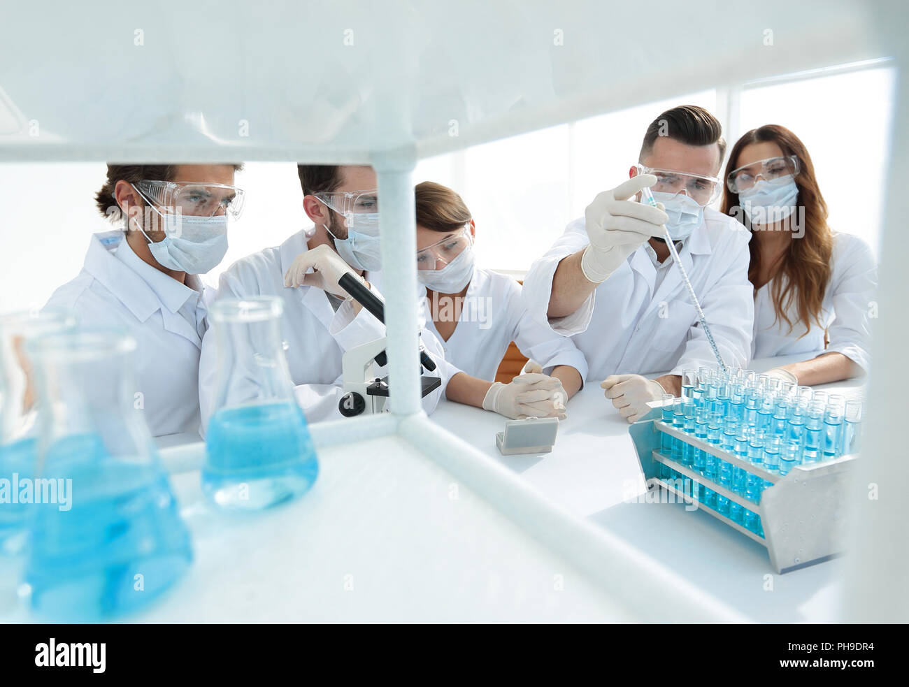 Scientists at chemical laboratory during work Stock Photo - Alamy
