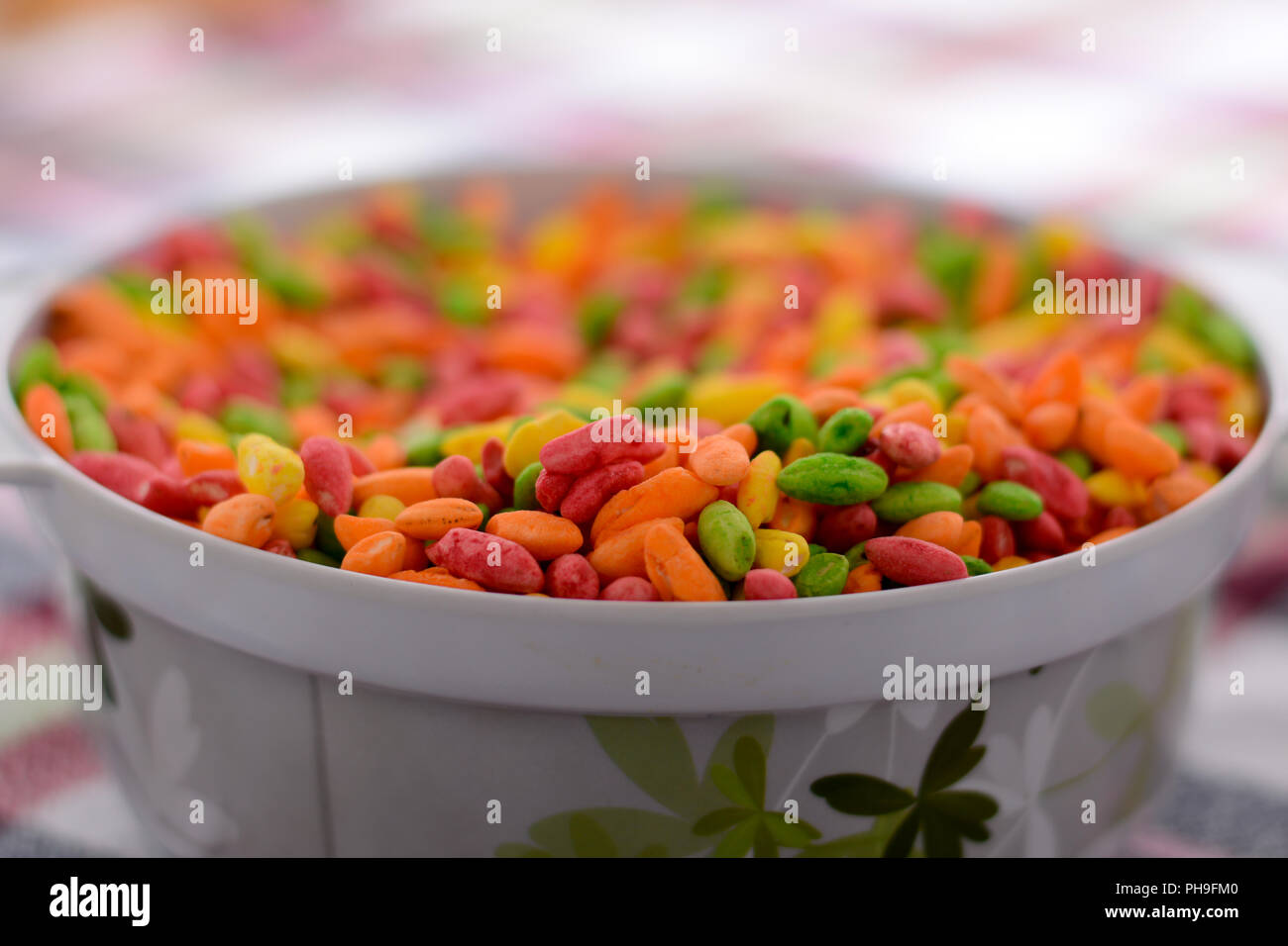 Puffed crispy colorful rice in the bowl Stock Photo - Alamy