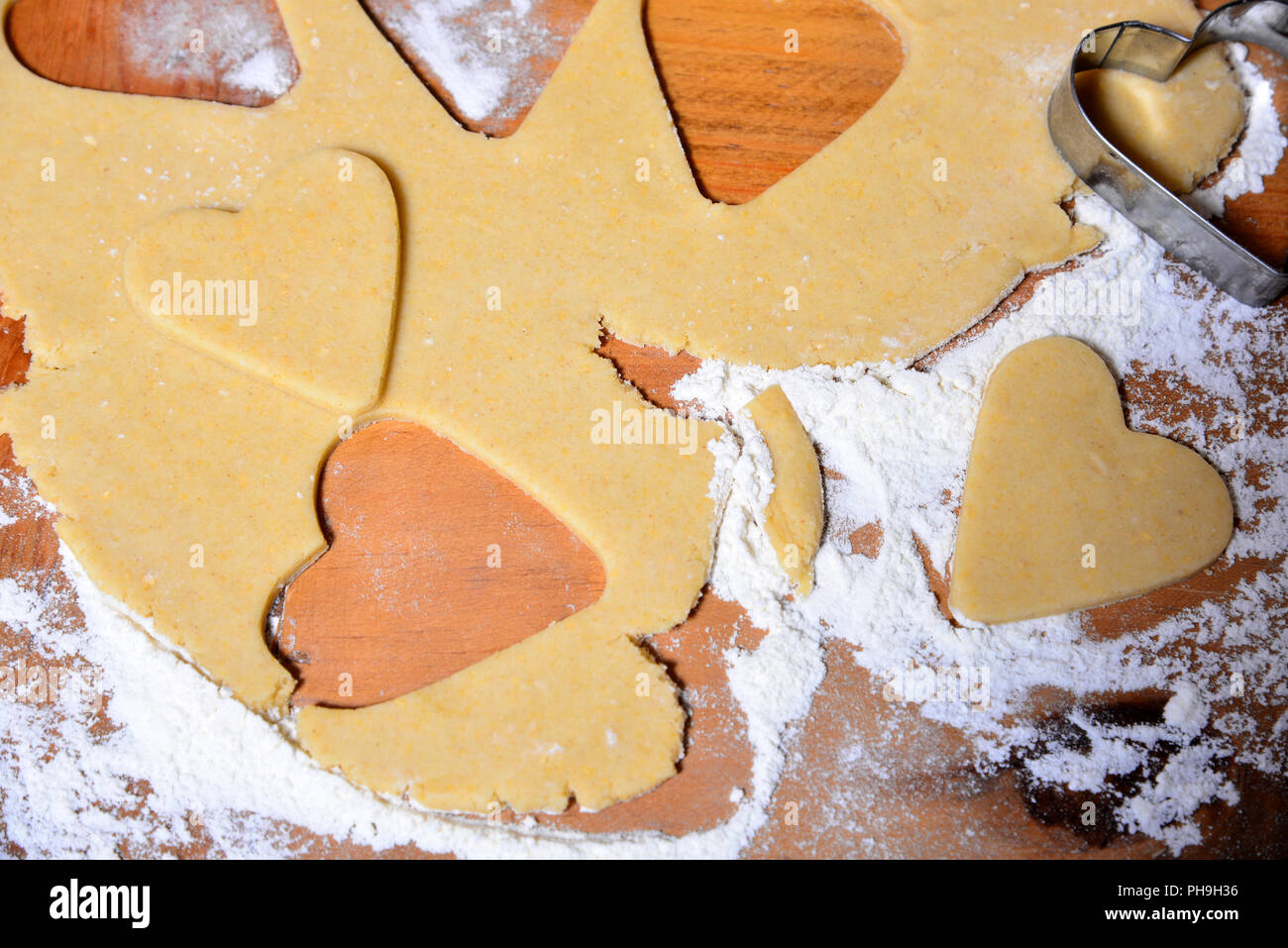 Baking cookies flour heart Stock Photo - Alamy
