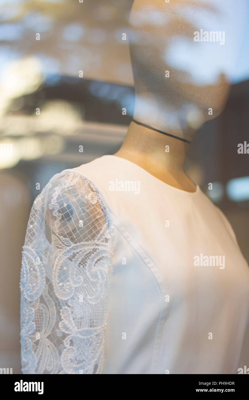 Bridal boutique brides white marriage dress in store window display on ...