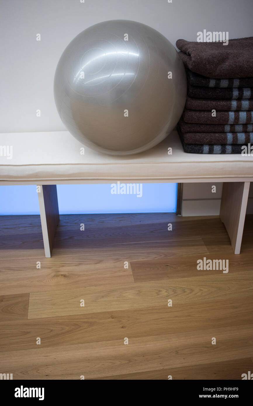 Pilates yoga fitness studio gym room with bench seat waiting and ...