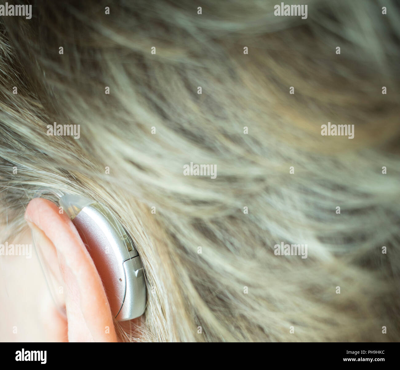 Deaf lady with modern technology digital hearing aid in her ear Stock ...