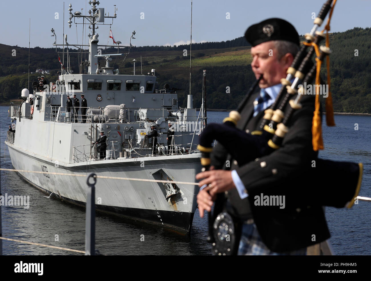 Piper Iain Macpherson plays during a welcome home ceremony as the Royal ...
