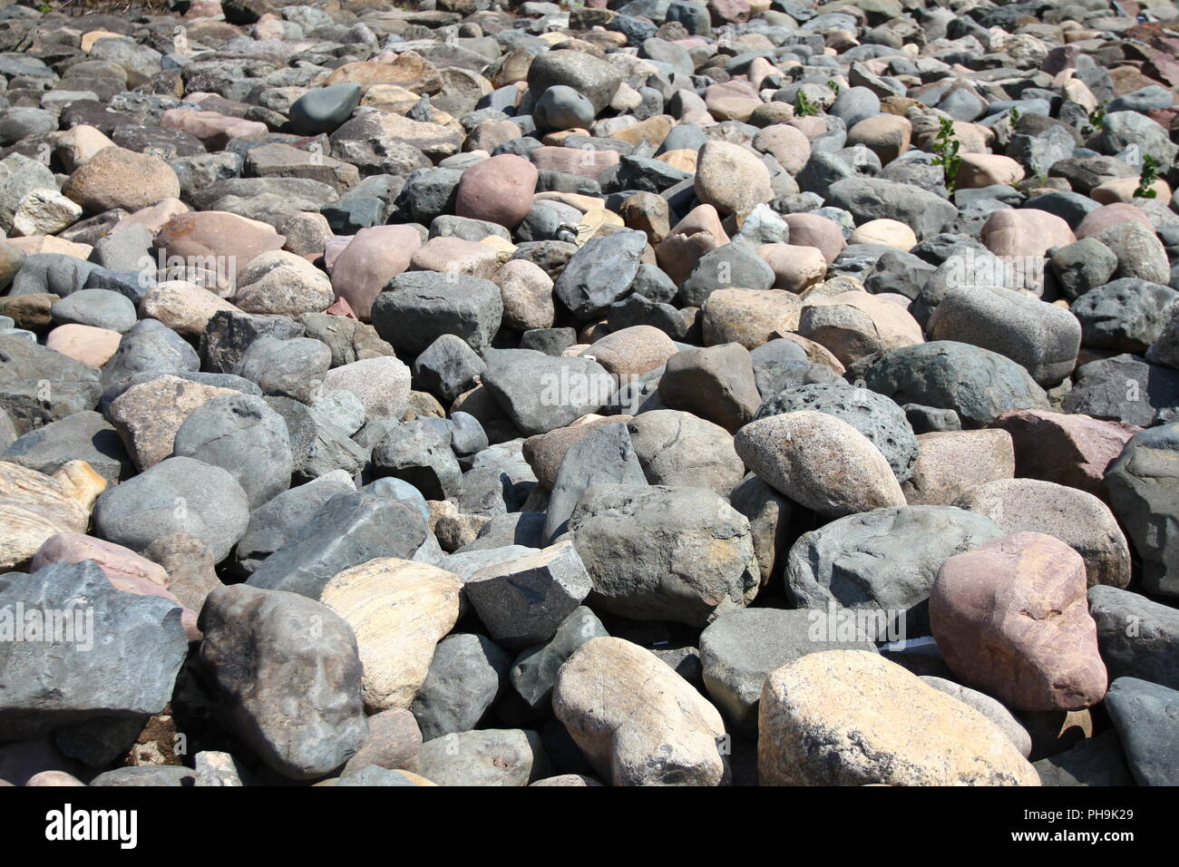 Water stones rocks pattern. Pebbles near water. Round stones background ...