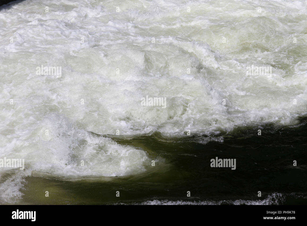 Splashes and spray from waterfall. Big water splash in lake after ...