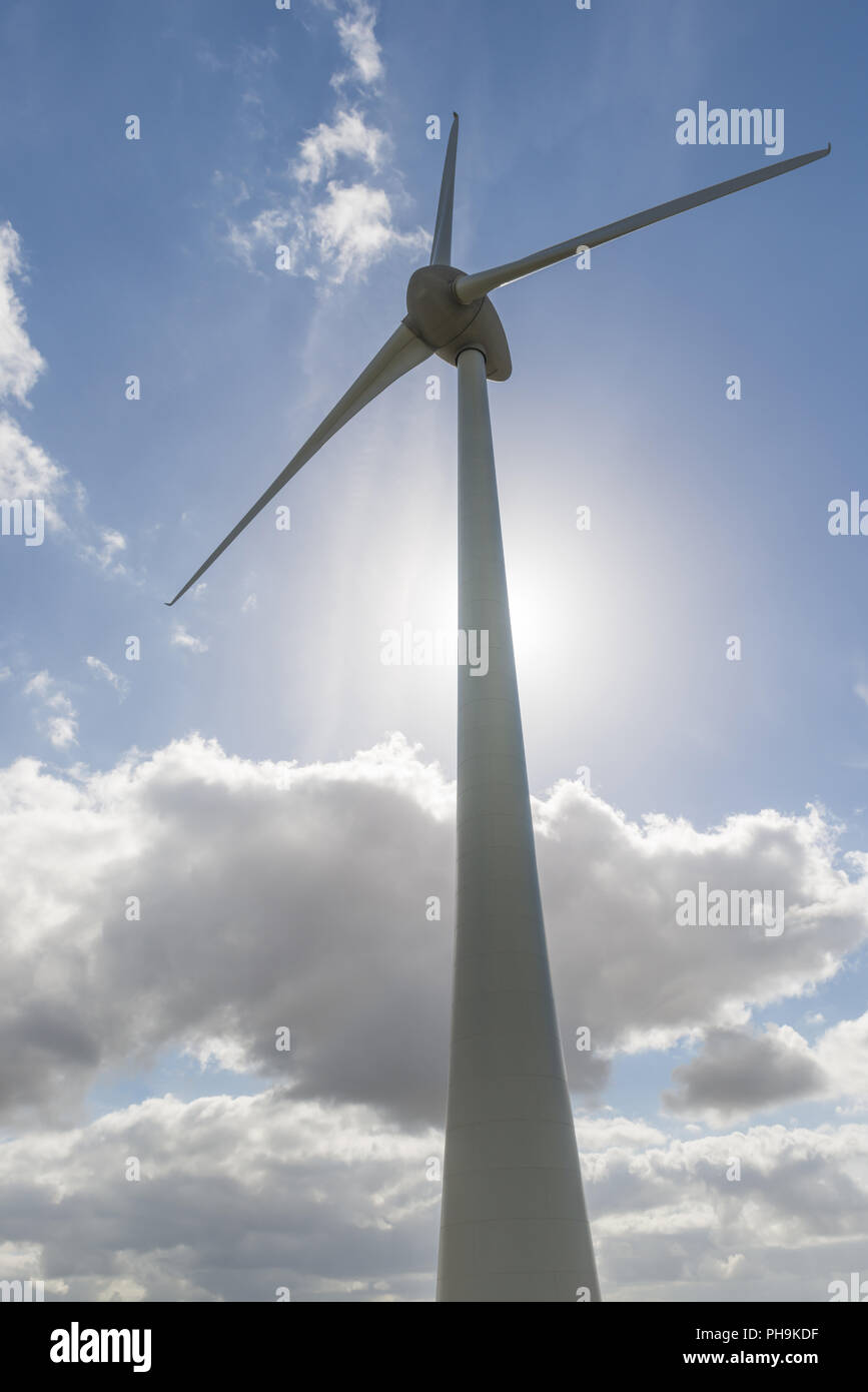 Modern windmill with against light from the Sun Stock Photo - Alamy
