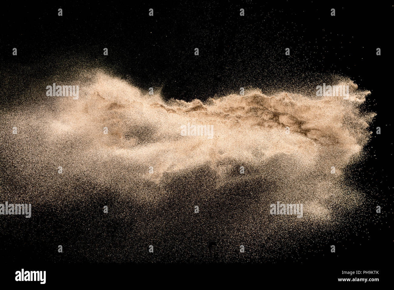 Dry river sand explosion. Golden colored sand splash against dark ...