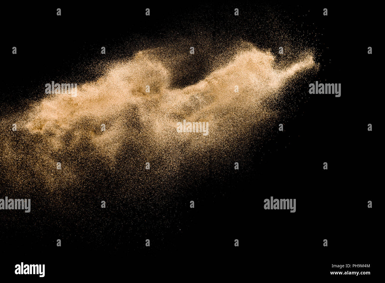 Dry river sand explosion. Golden colored sand splash against dark ...
