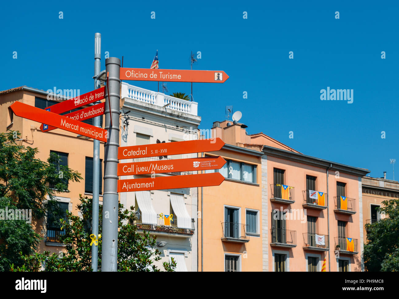Girona, Spain - July 9, 2018: Signpost pointing to major landmarks in ...