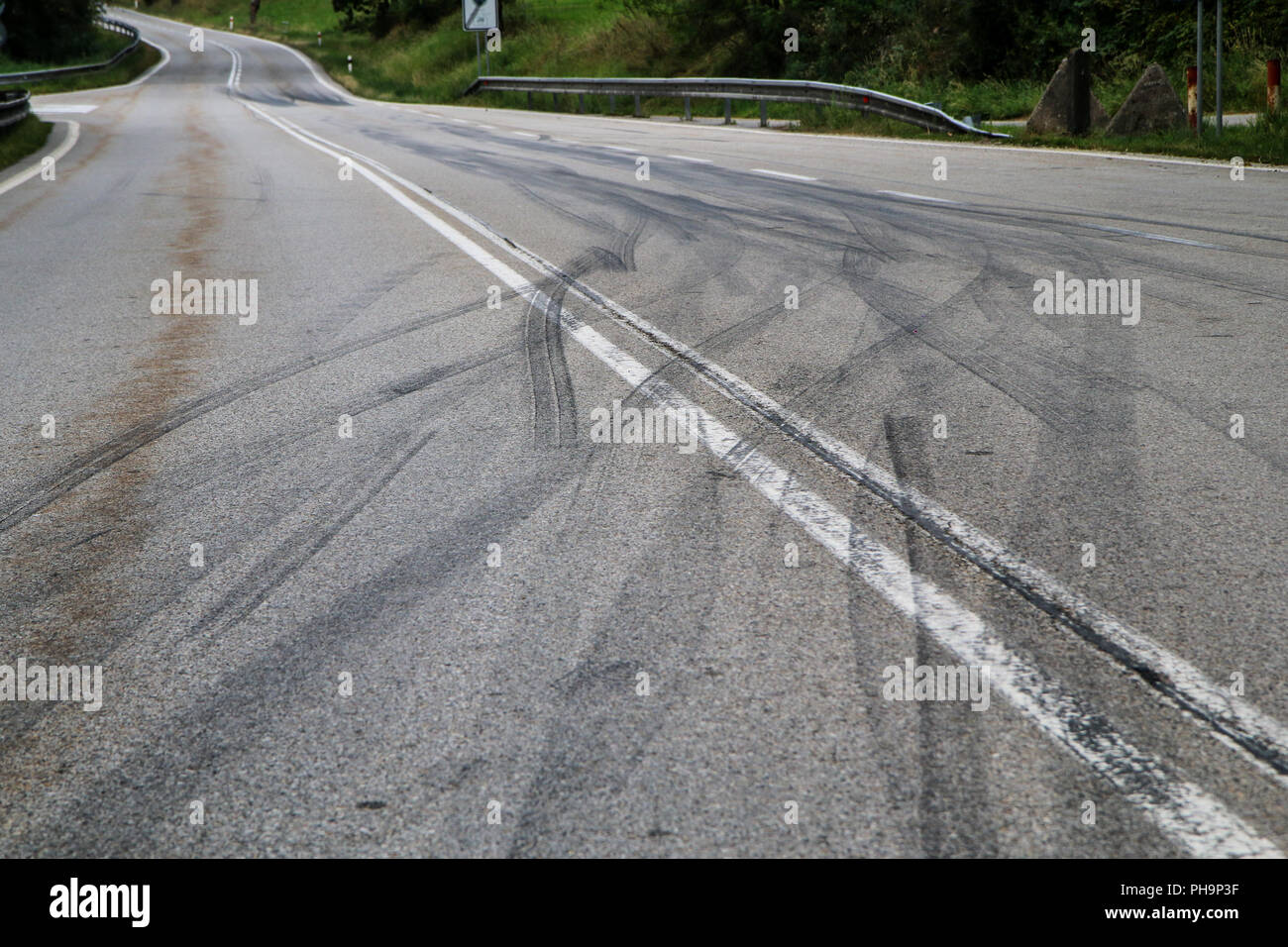 The rubber tracks from the racing cars left on the tarmac at the start ...