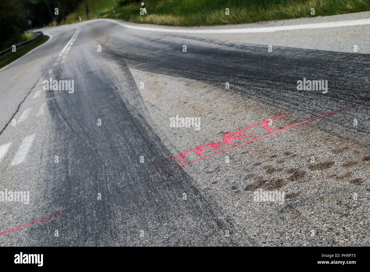 The rubber tracks from the racing cars left on the tarmac at the start ...