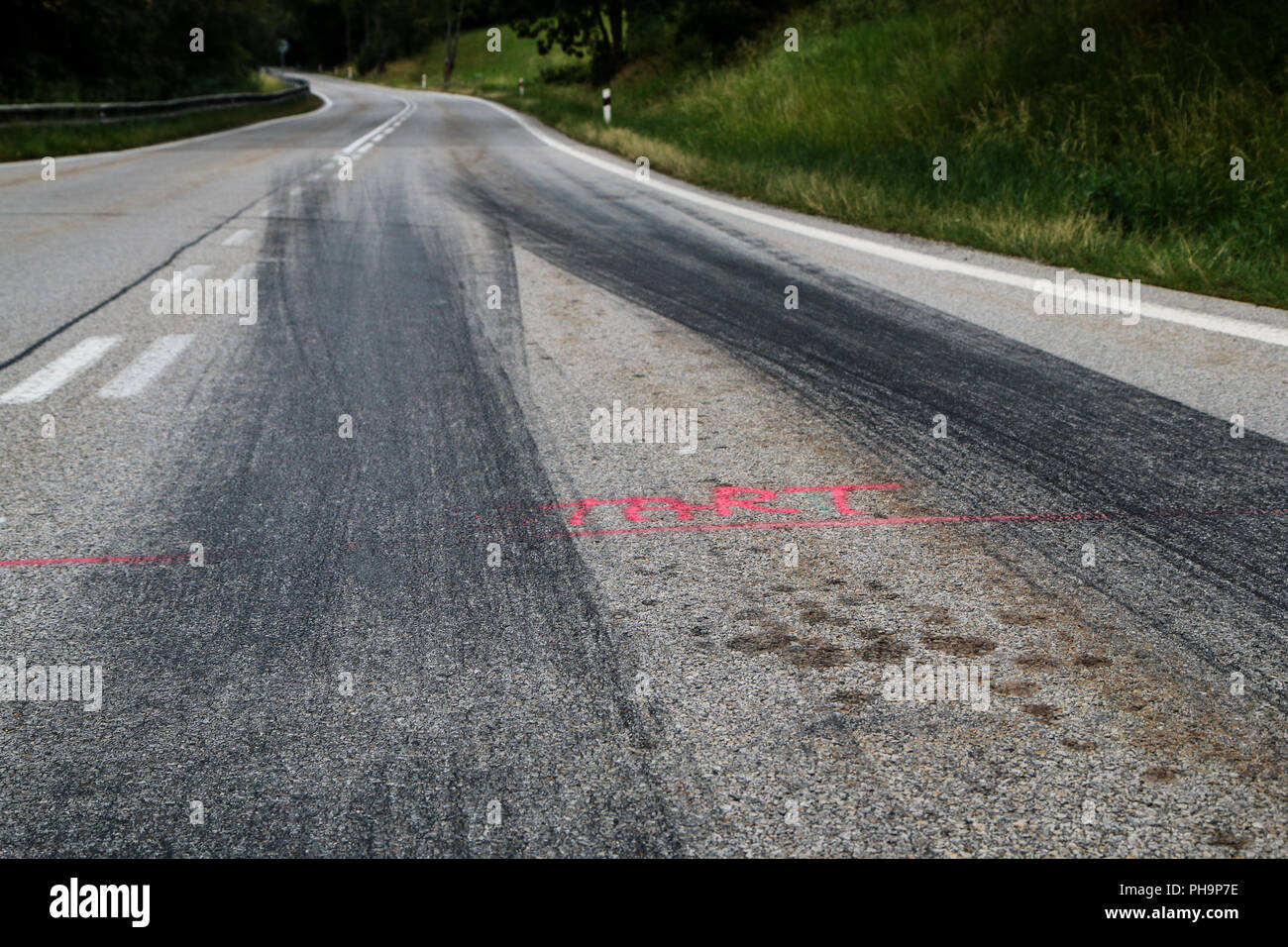 The rubber tracks from the racing cars left on the tarmac at the start ...