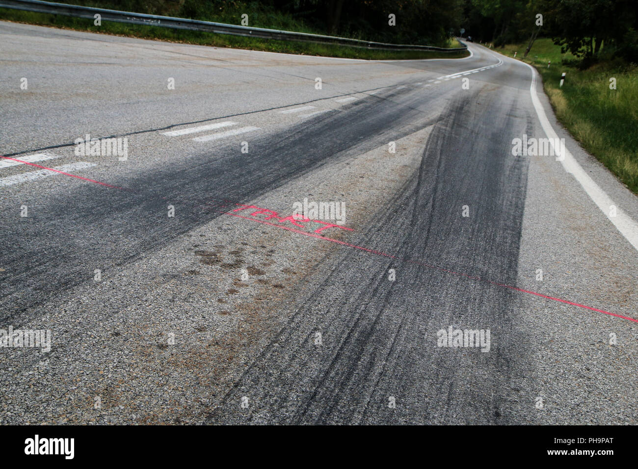 The rubber tracks from the racing cars left on the tarmac at the start ...