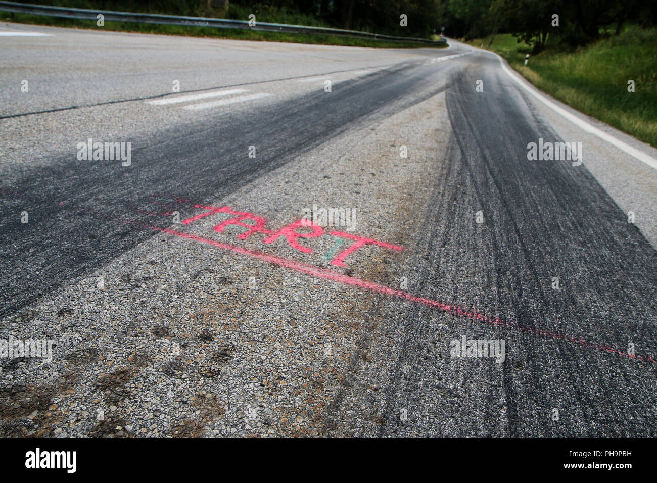 The rubber tracks from the racing cars left on the tarmac at the start ...