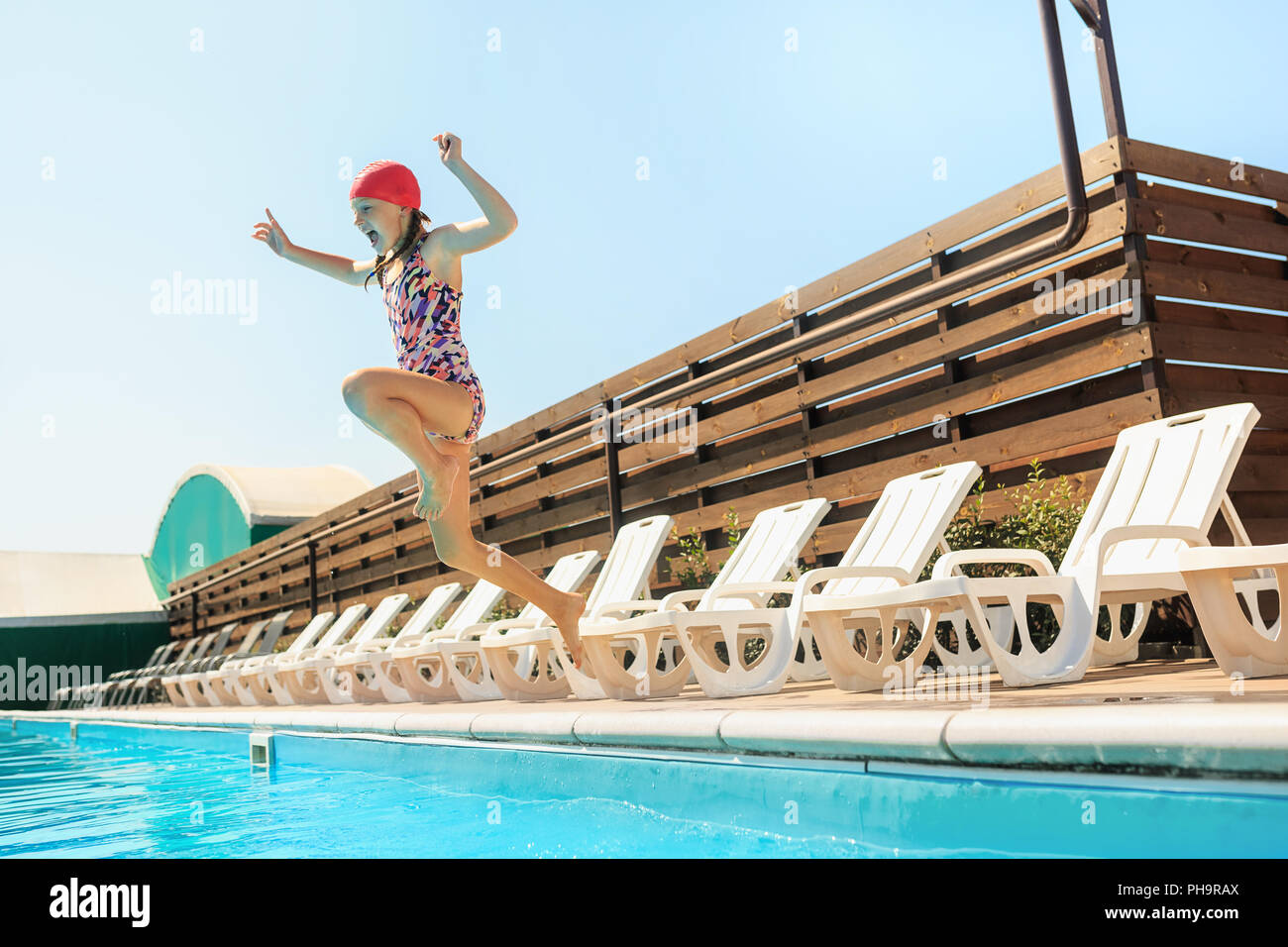 Little kid jumping swimming pool hi-res stock photography and images ...