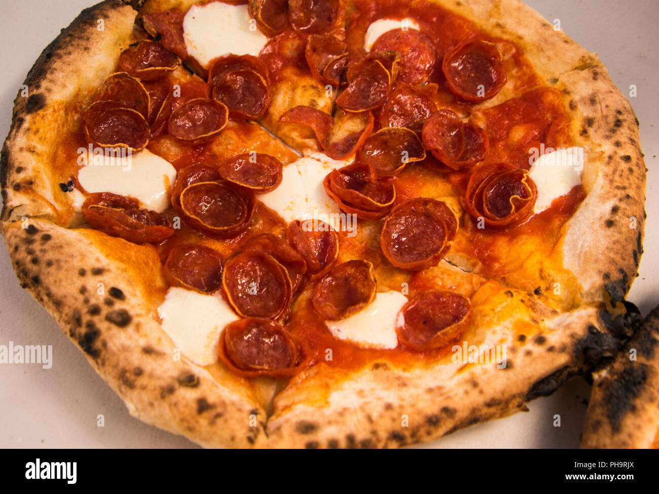 Burnt cheese pizza hi-res stock photography and images - Alamy