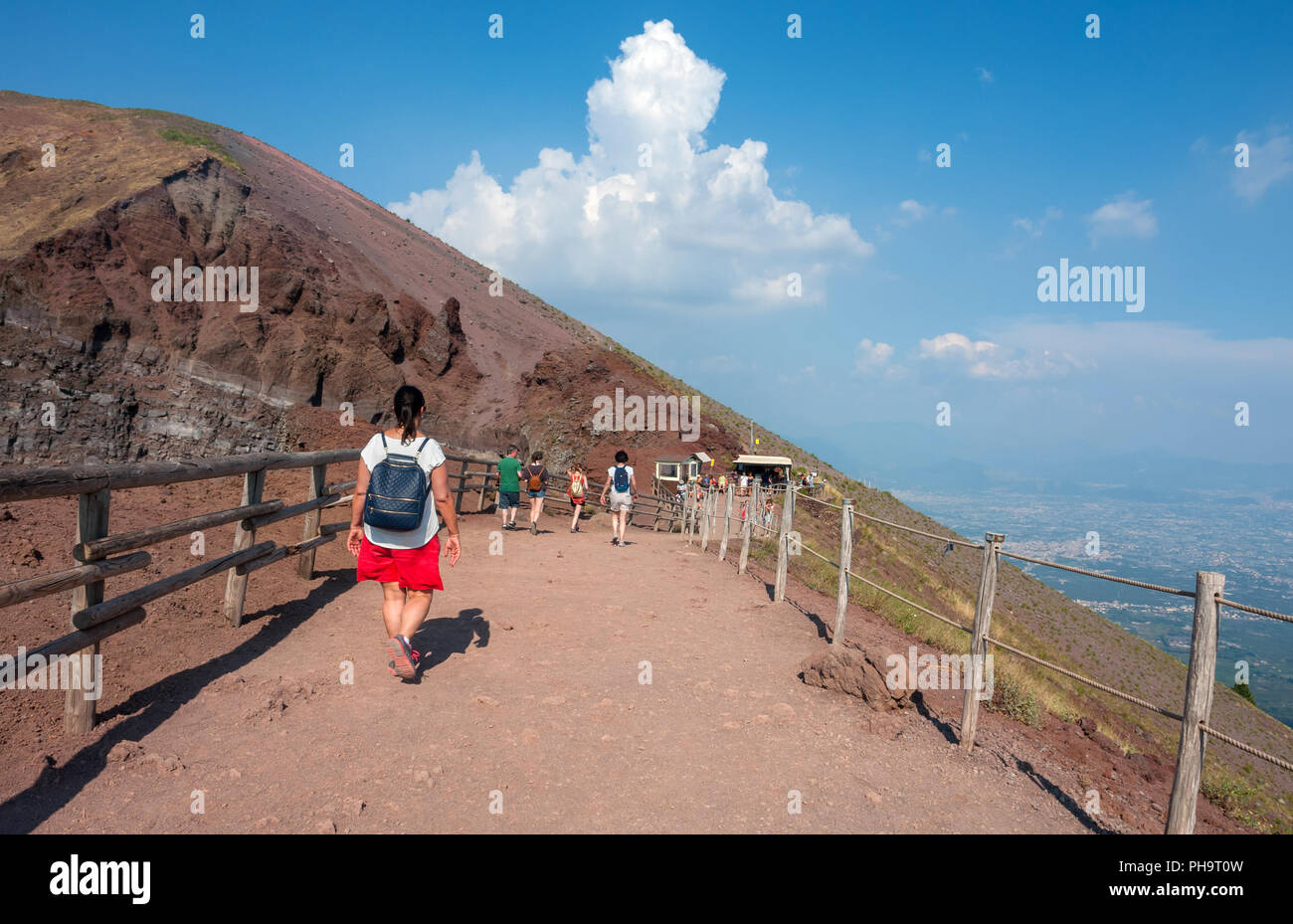 MOUNT VESUVIUS, ITALY - AUGUST 1, 2018: Tourists walk around the crater ...