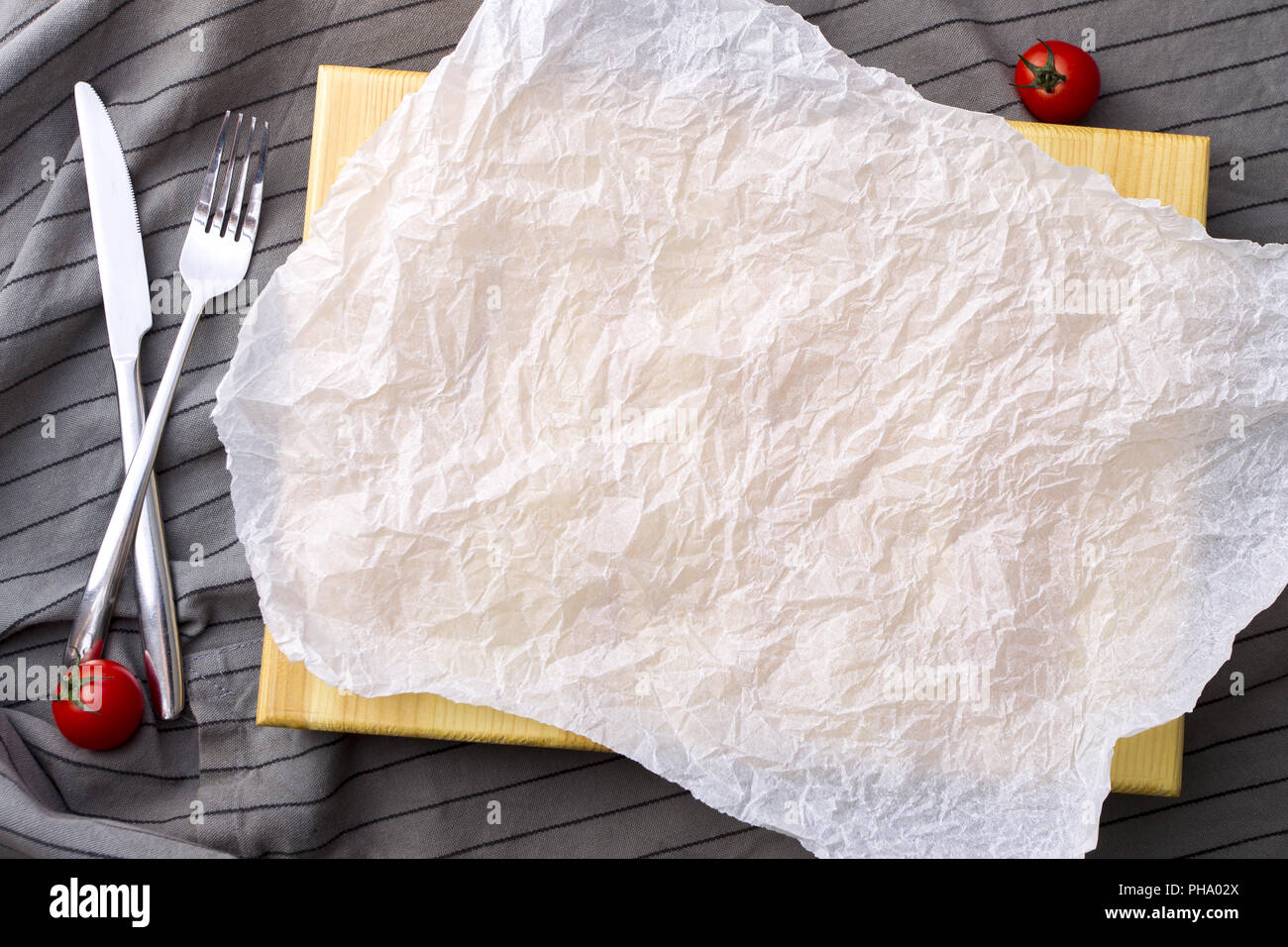 Wooden plate with utensils Stock Photo - Alamy