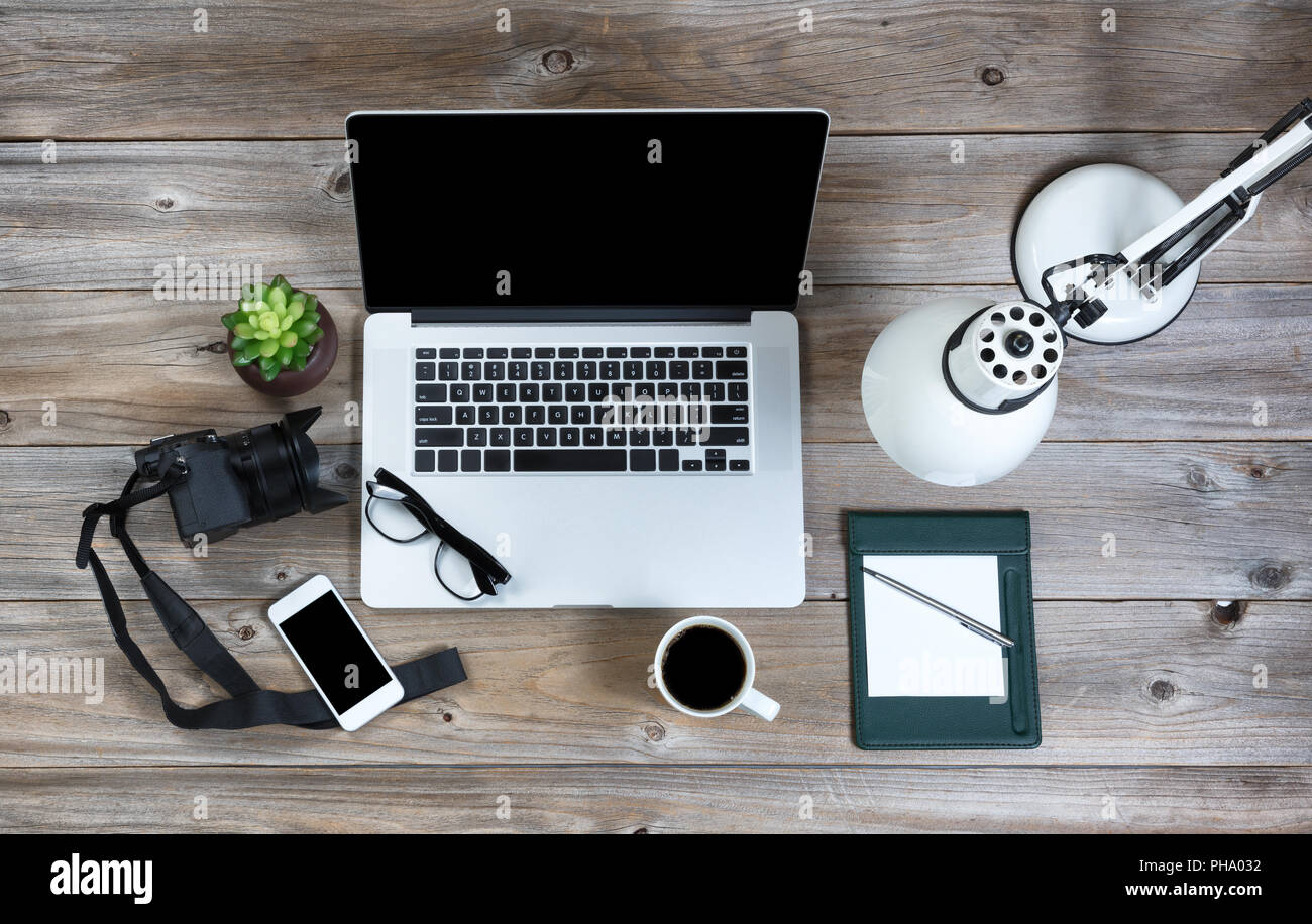 Technology with working desktop in overhead view on rustic wood Stock ...