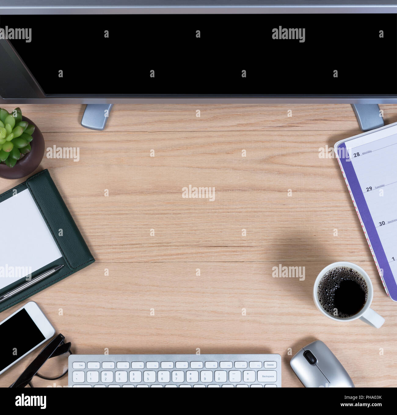 Working desktop in overhead view on oak wood Stock Photo - Alamy
