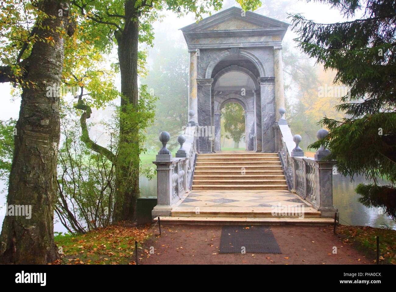 Siberian bridge and foggy autumn morning Stock Photo - Alamy