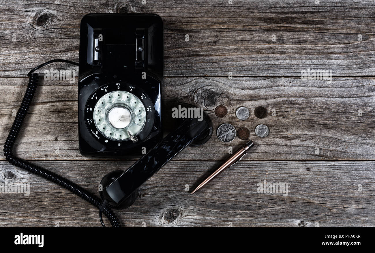 Old telephone with various old vintage objects on stressed wood Stock ...