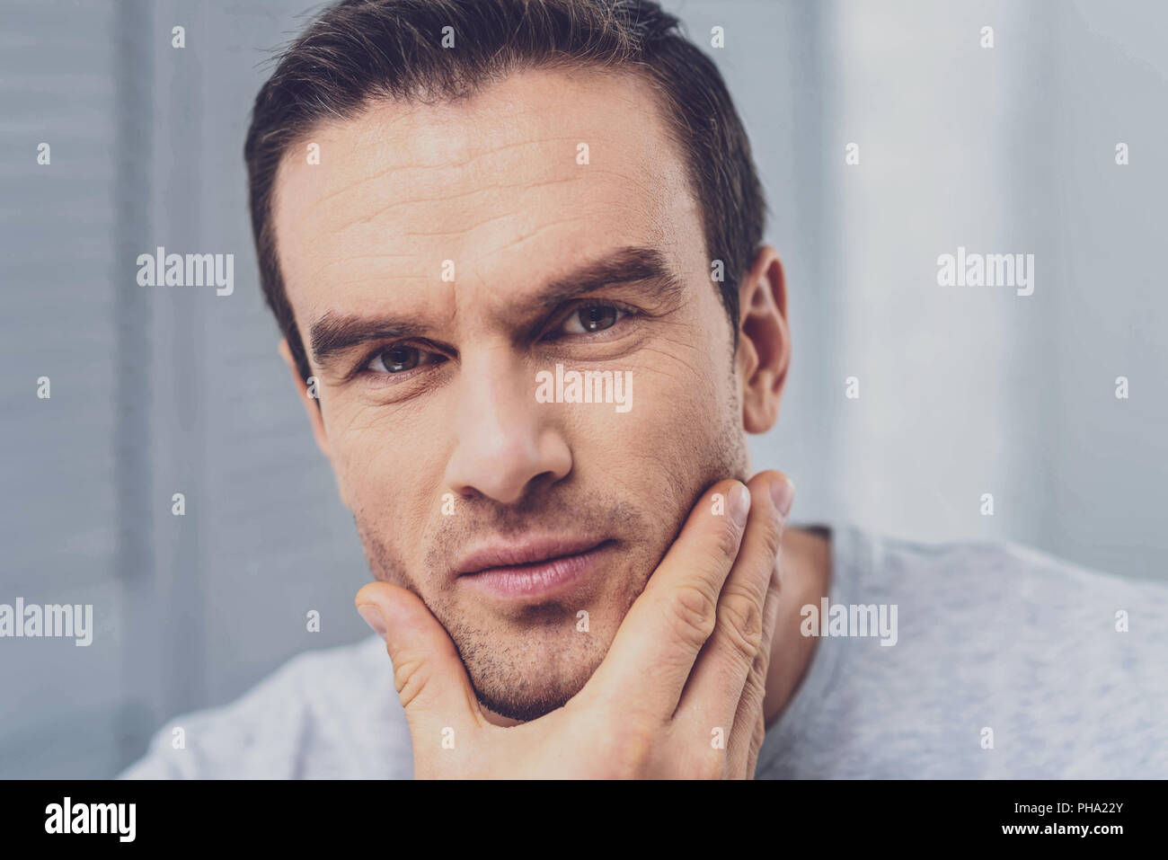 Handsome successful man looking into the mirror Stock Photo - Alamy