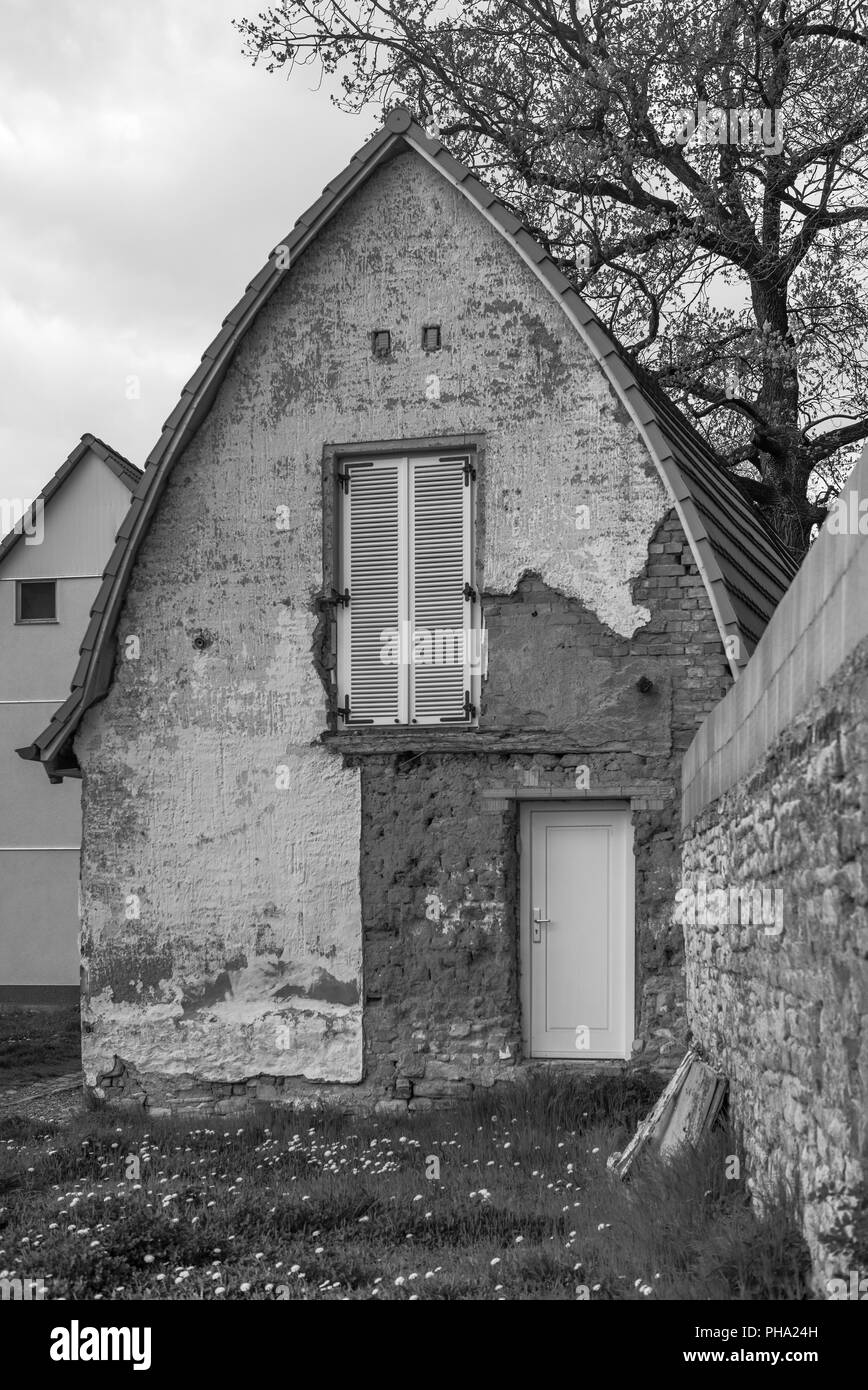 Old house by the wall Stock Photo - Alamy