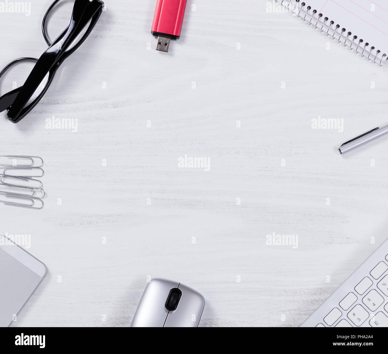 Work objects in circle pattern on white desktop Stock Photo - Alamy