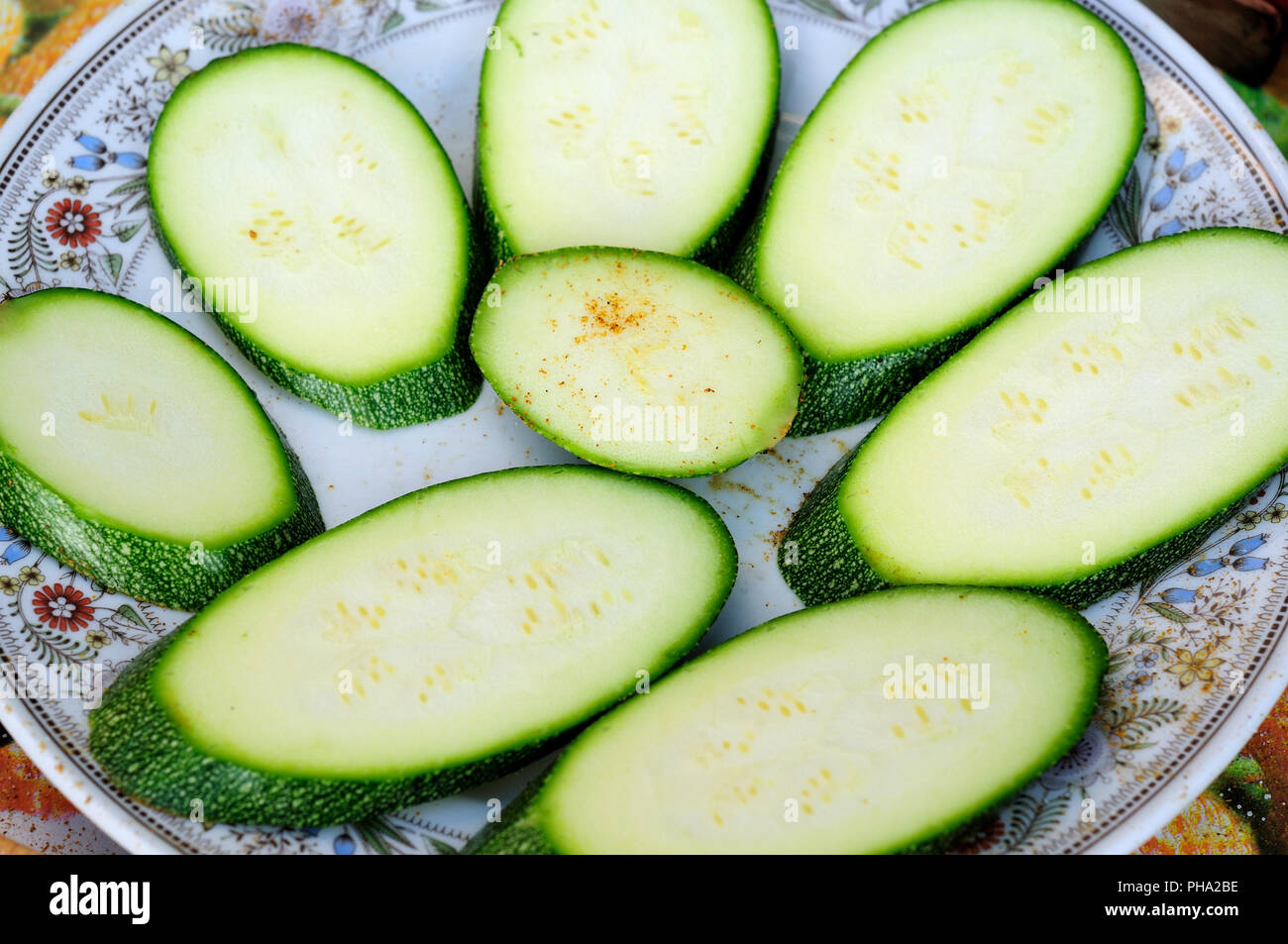 Zucchini cut into slices Stock Photo - Alamy
