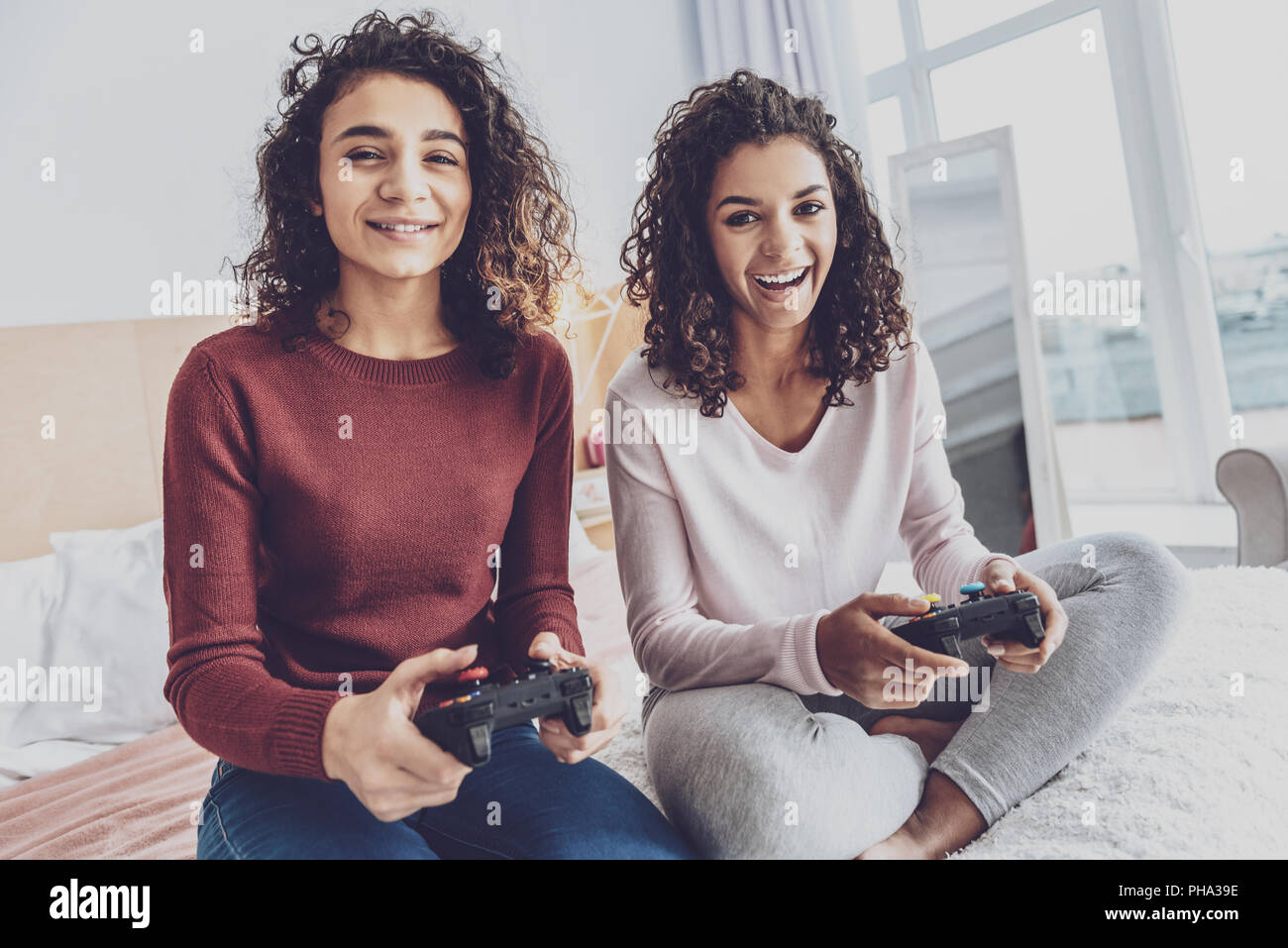 Emotional sisters having fun together Stock Photo - Alamy