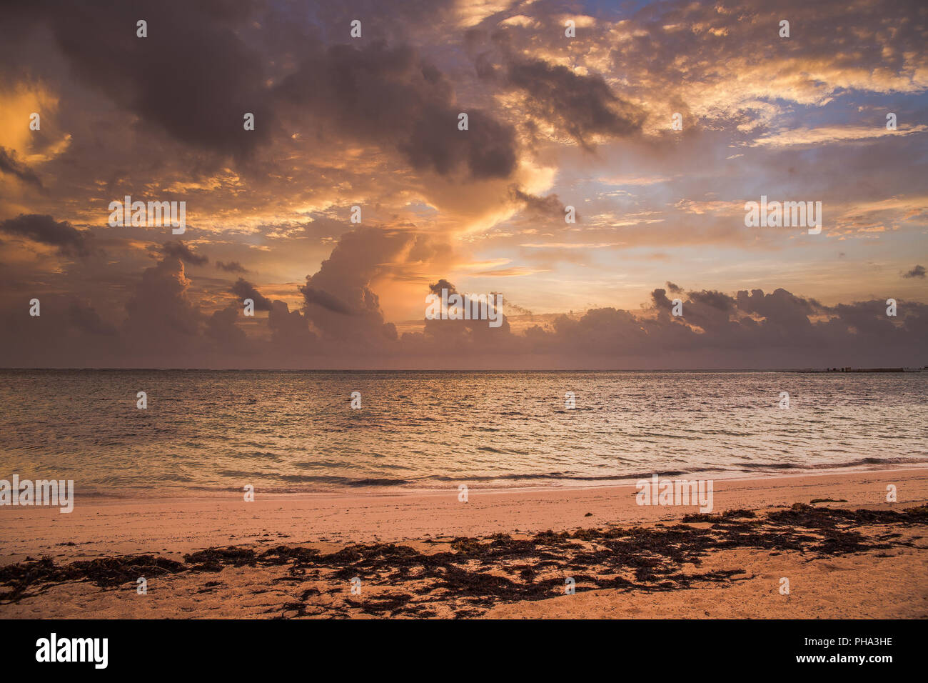 Sunrise over water Stock Photo - Alamy