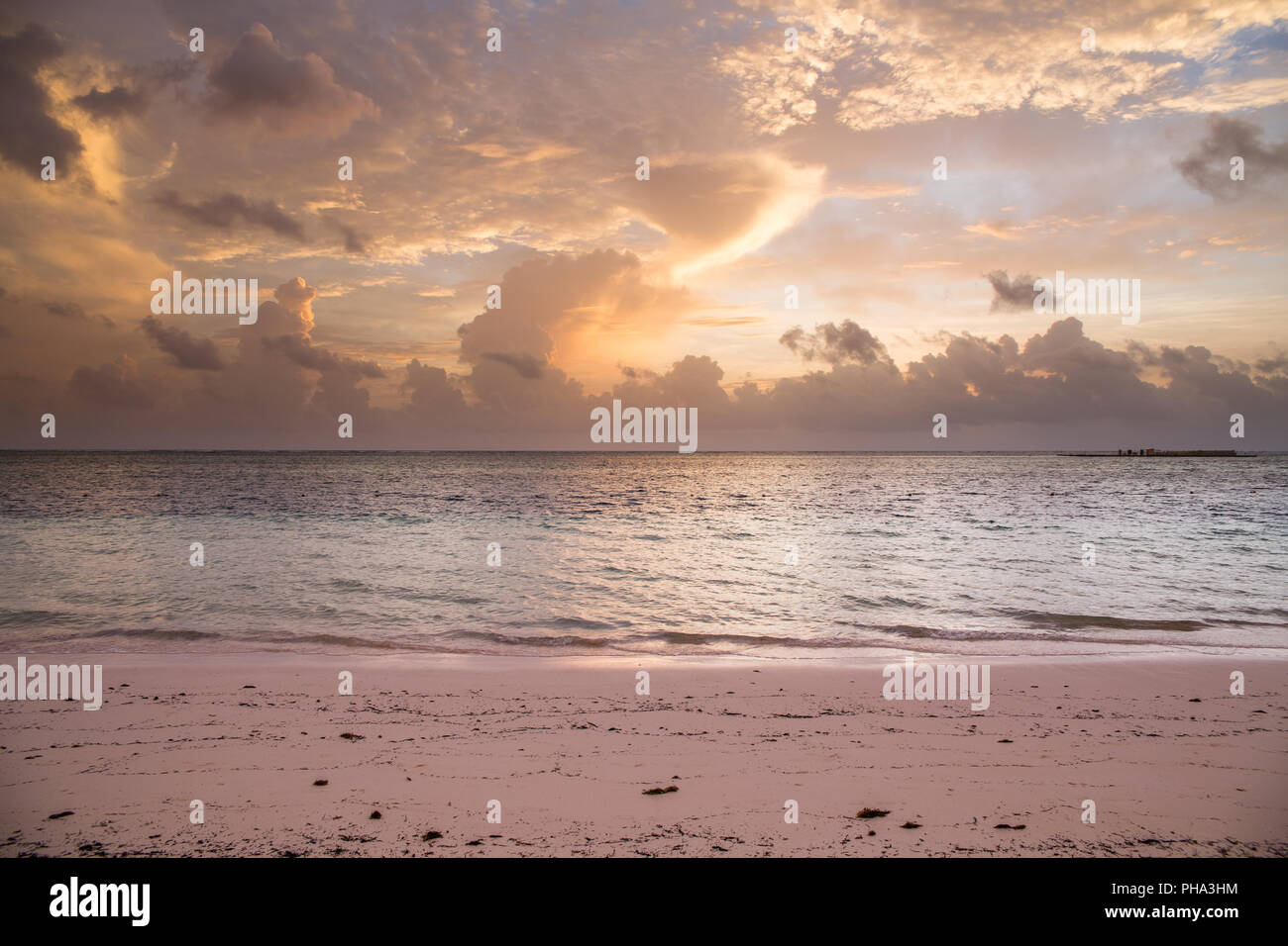 Sunrise over water Stock Photo - Alamy