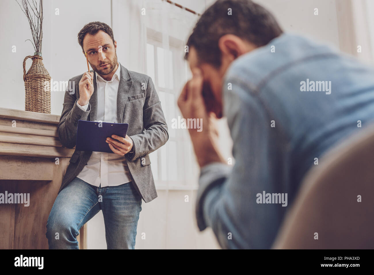 Concentrated male person being deep in thoughts Stock Photo - Alamy