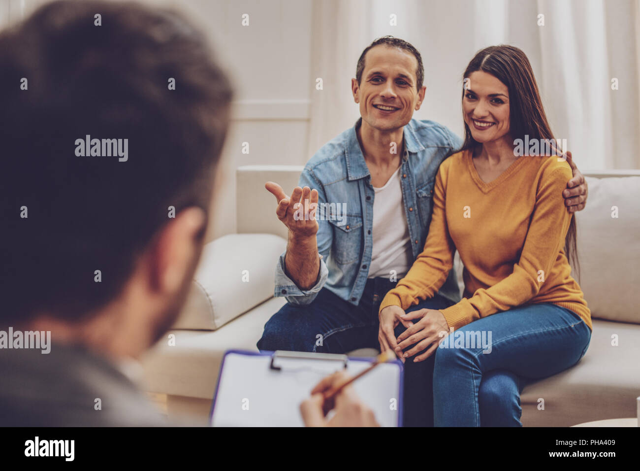 Happy young people embracing each other Stock Photo - Alamy
