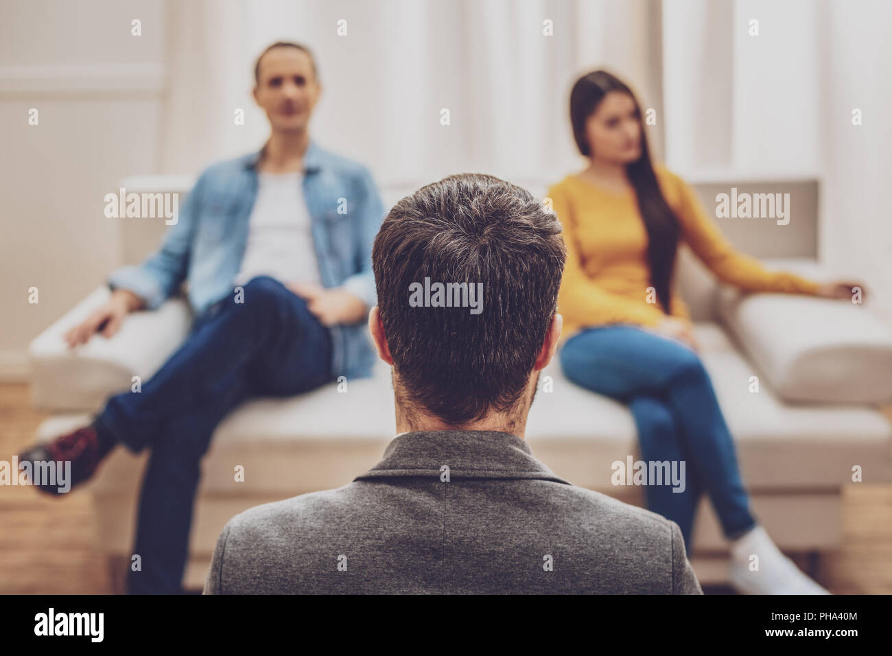 Psychologist writing down thoughts during session Stock Photo - Alamy