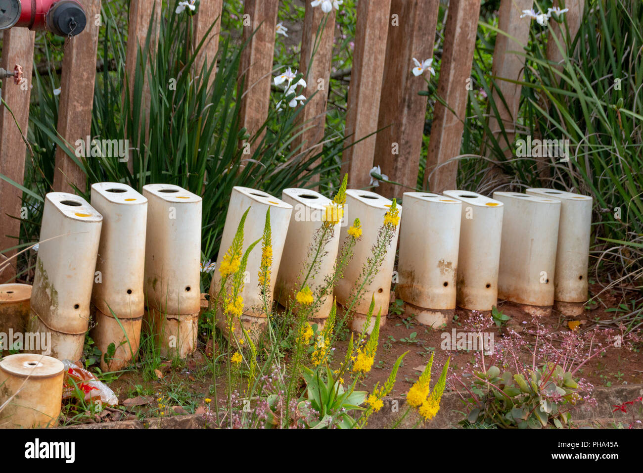 A close up view of ten water meters in a row next to the road Stock ...