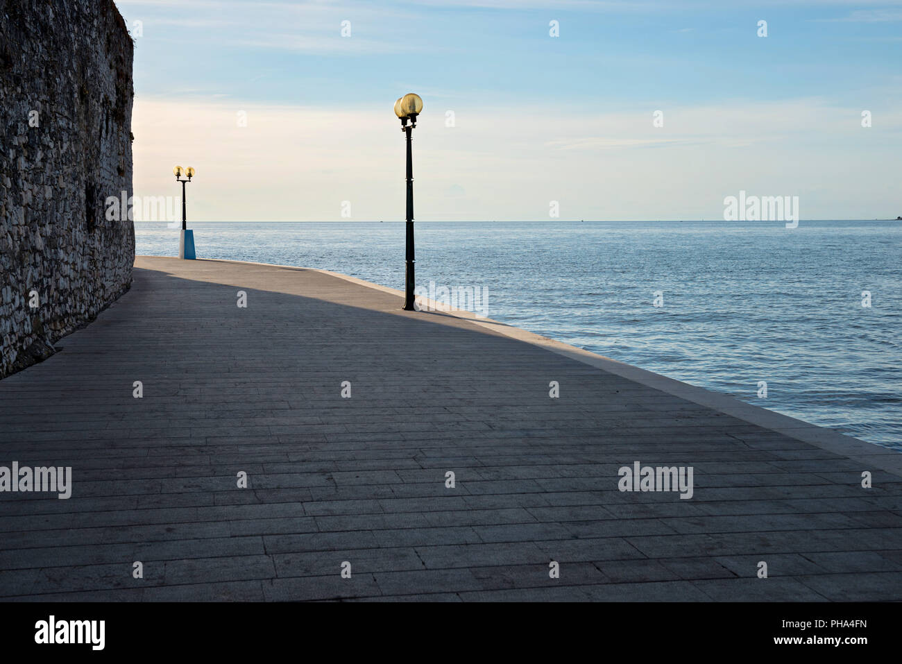 Waterfront area in sunset Stock Photo - Alamy