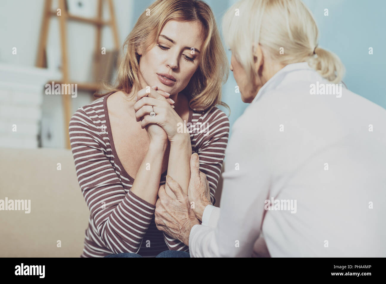 Beautiful young woman feeling upset Stock Photo - Alamy