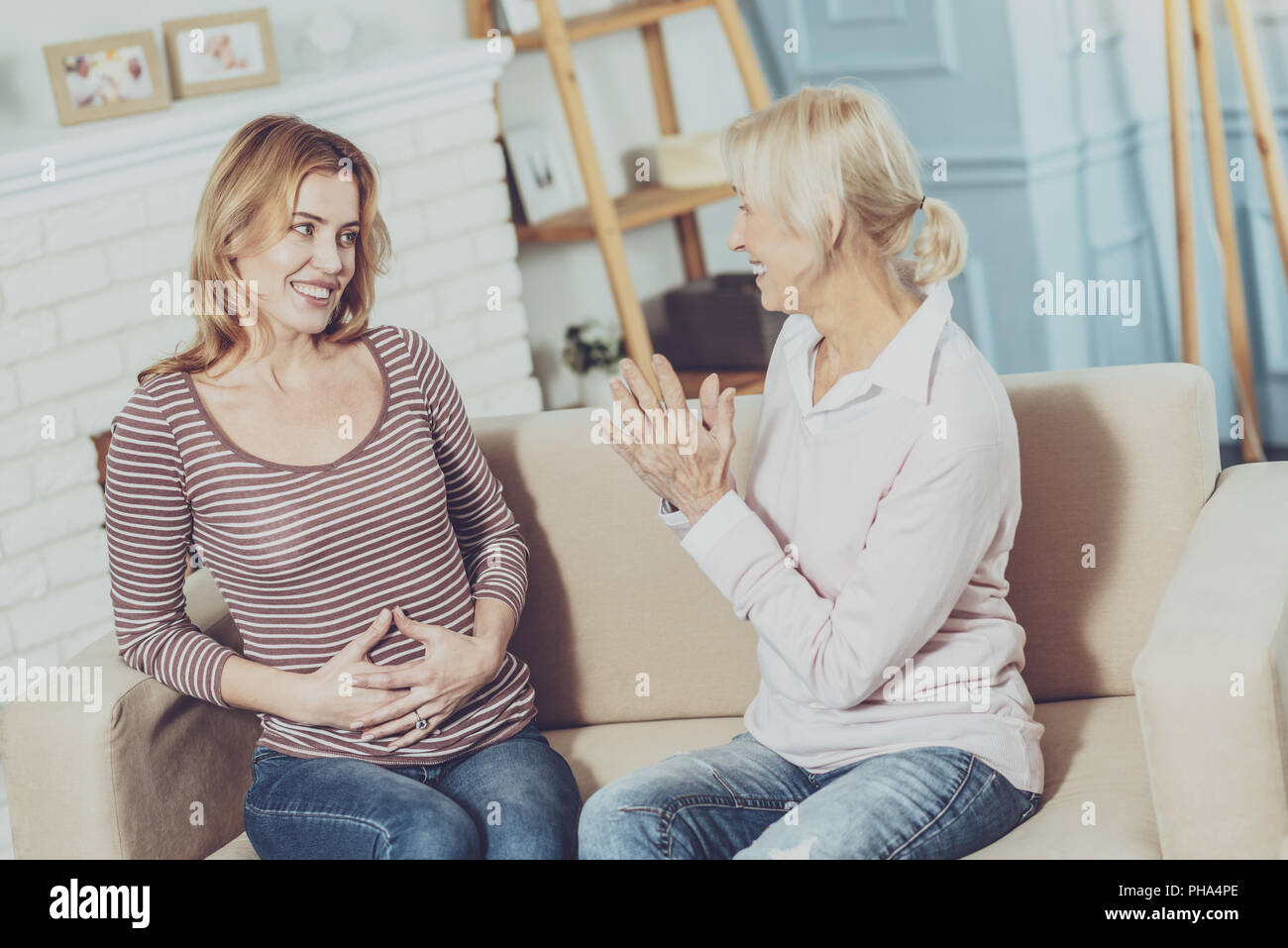 Cheerful aged woman clapping her hands Stock Photo - Alamy