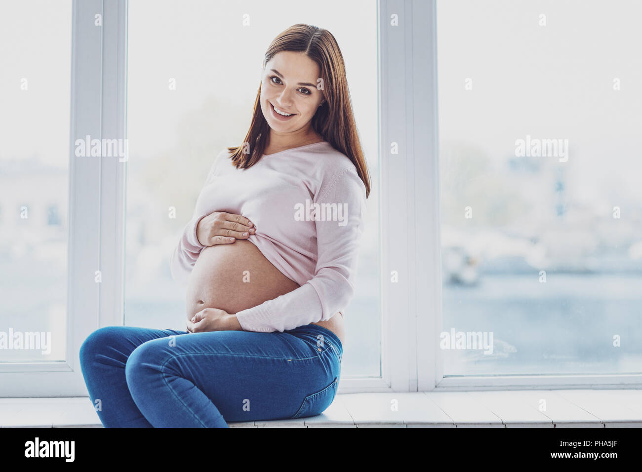 Adult pregnant woman sitting window hi-res stock photography and images ...